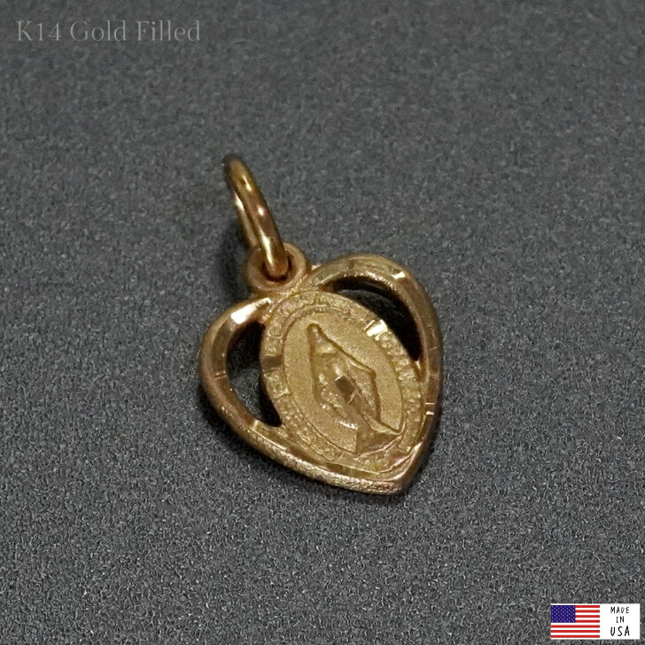 ゴールドフィルドのハート形透かし不思議のメダイです。スターリングシルバーや14Kゴールドフィルド、14Kゴールド製を中心にハイクオリティのメダイやクロスなどのキリスト教のアイテムを製造する1900年より続くアメリカの老舗Bliss Manu...