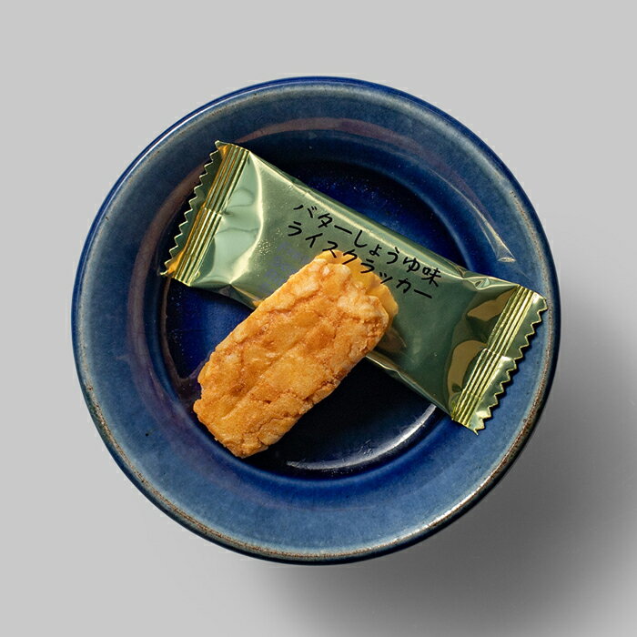 名称：米菓子原材料名：うるち米（国産）、植物油脂、粉末醬油／加工澱粉、香料（バターオイル）、着色料（カラメル）、調味料（アミノ酸等）、（一部に小麦・大豆を含む）内容量：60g賞味期限：パッケージに記載保存方法：高温多湿を避け涼しいところで保...