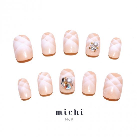 [商品説明]スキンカラーのベースにエアブラシで描いたチェックが素敵なネイルです。