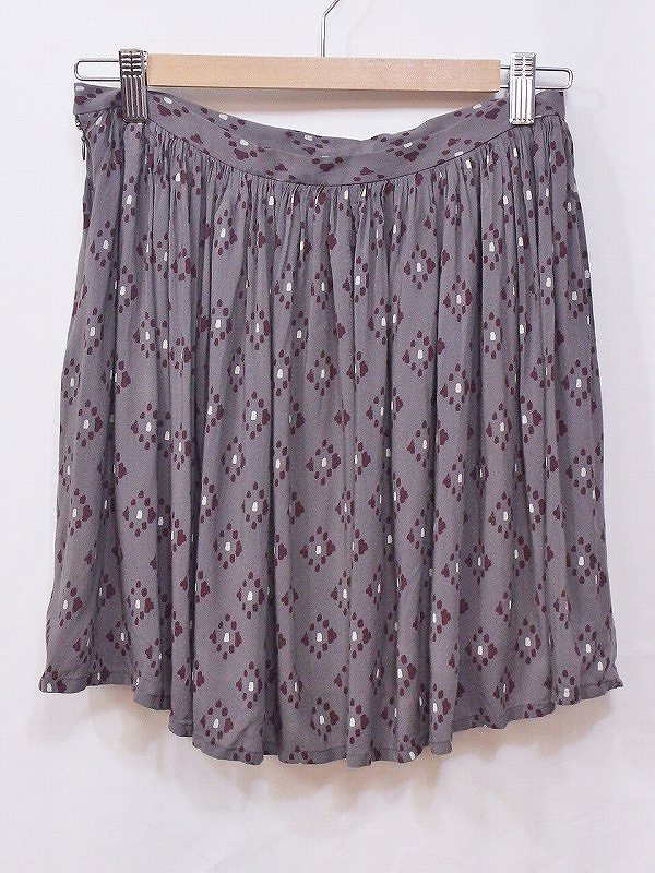 商品名POMANDERE ミニスカート　裏地あり カラーグレージュ×ブラウン サイズ ( cm )サイズ表記 ： 38・ ウエスト(平置)34 ・ 着丈40素材ビスコース：100％季節の目安・通年　※品質タグや素材もご参考くださいコンディシ...