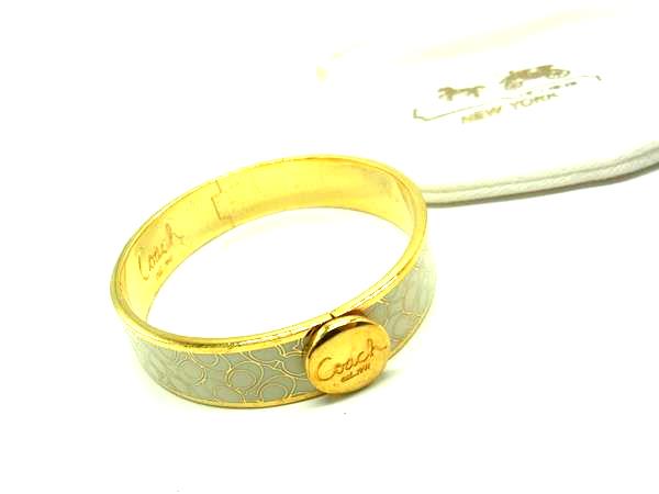 商品情報 ブランド名 COACH コーチ 状態ランク ABランク(美品) ライン カラーゴールド系×ホワイト系 素材 サイズ 内周約18cm ポケット 付属品画像内にあるものが全てになります シリアル及び刻印 状態使用感小　汚れ小　小傷　く...